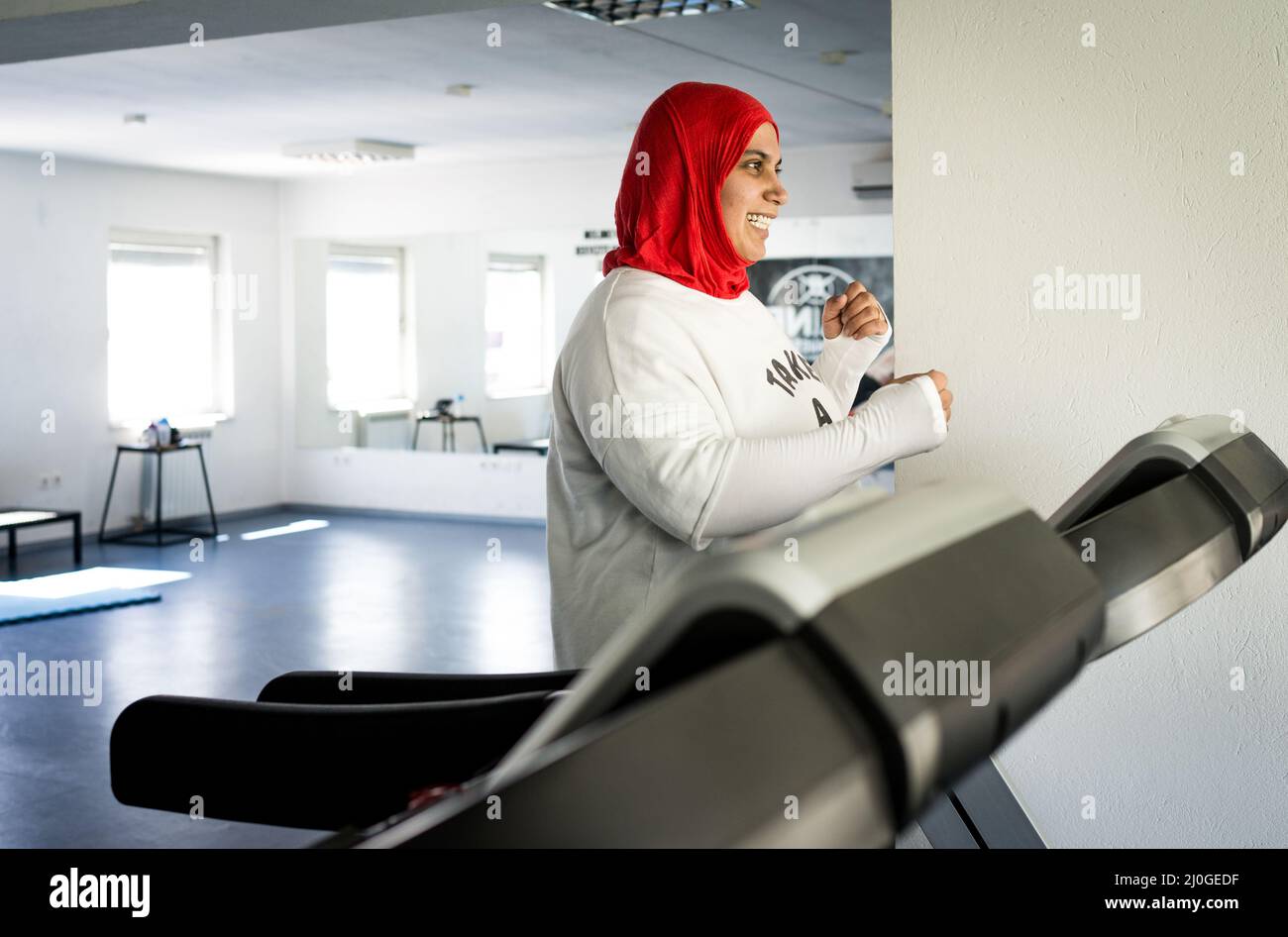 Arabic woman active working out in gym Stock Photo - Alamy