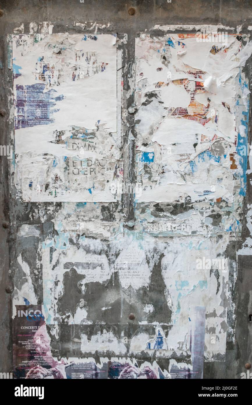 Ripped torn advertisement Stock Photo - Alamy