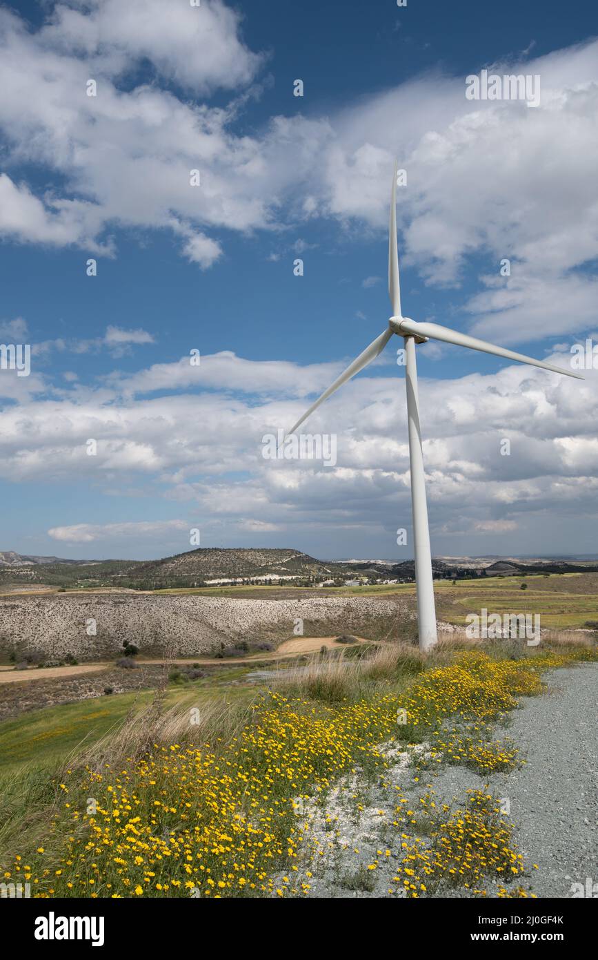 Windmills power generators on a turbine farm generating electricity ...