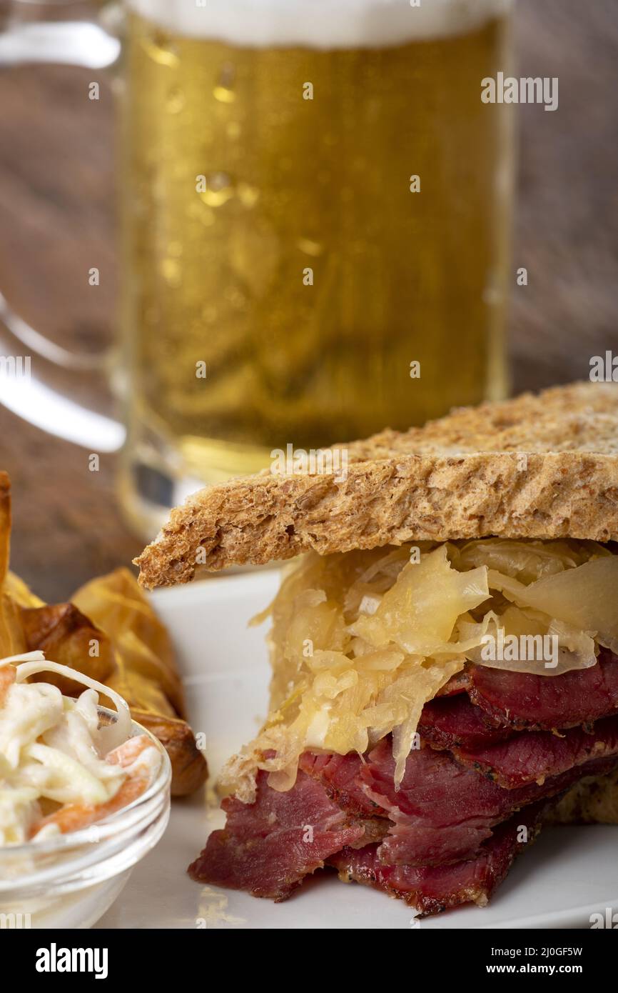 Reuben sandwich on a plate with fries Stock Photo - Alamy