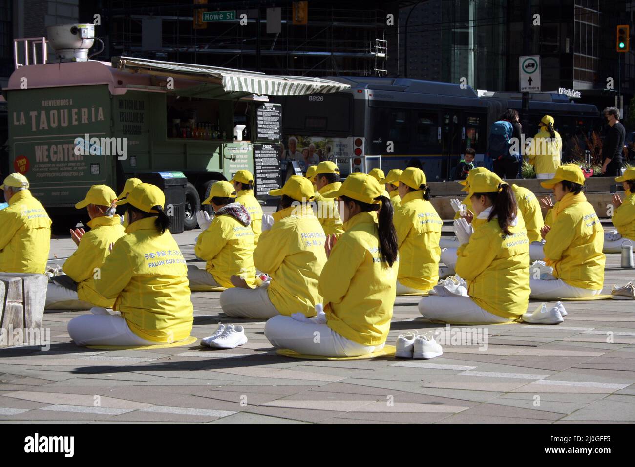 Group of people in yellow jackets sitting in front of the Art Gallery ...