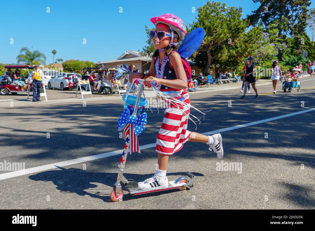 Young girls with American flag parading at the 4th of July Independence ...