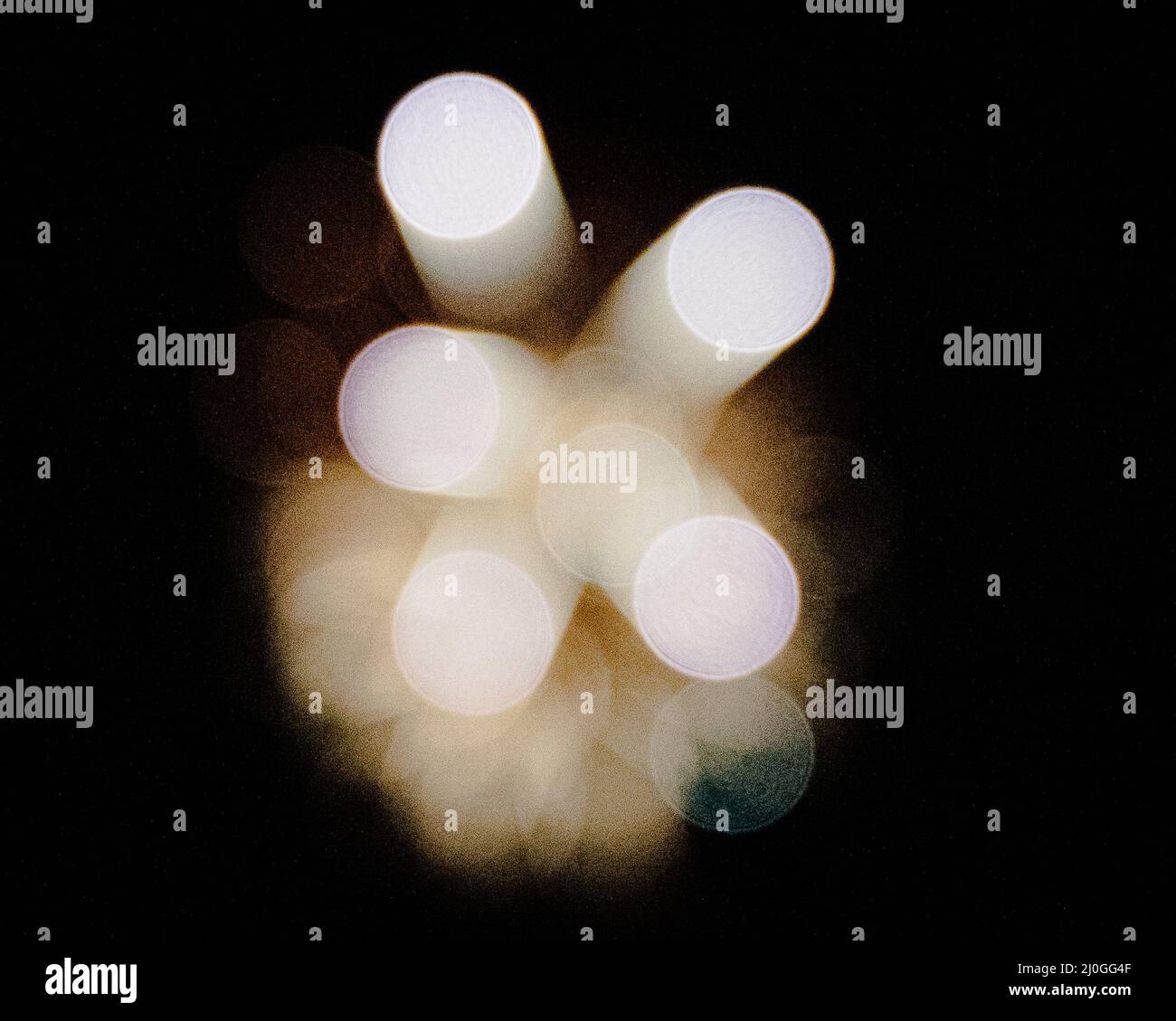 Blurred overlapped light circles on a black background Stock Photo - Alamy