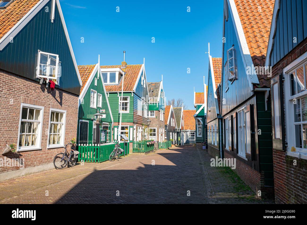 Street with classic Dutch wooden houses in the historic village of ...