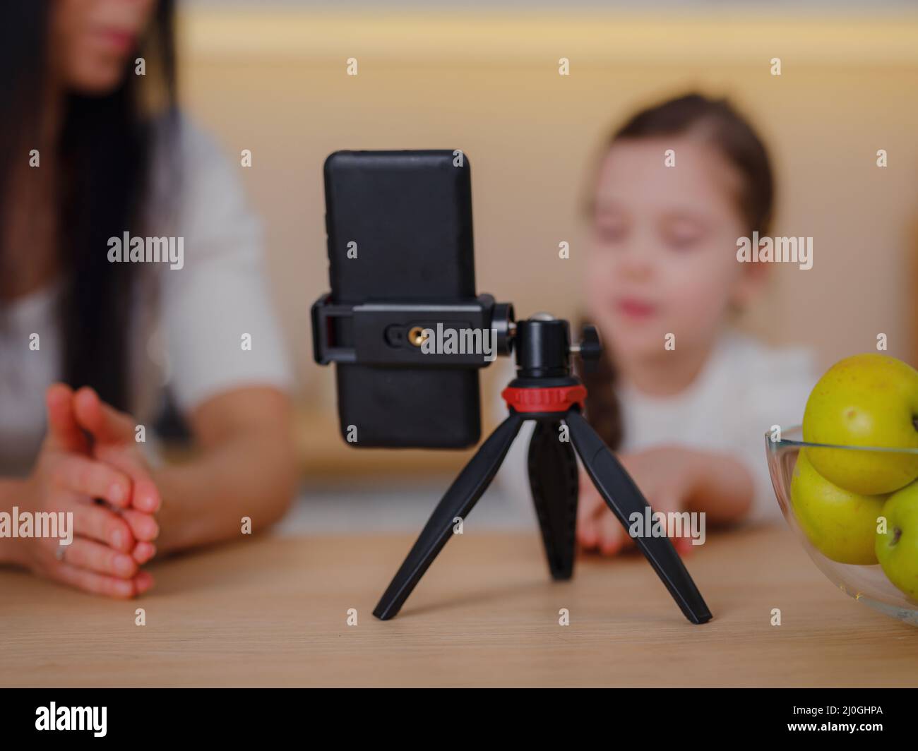 Blogger mom with her baby at home. Millennial Influencer woman creating ...