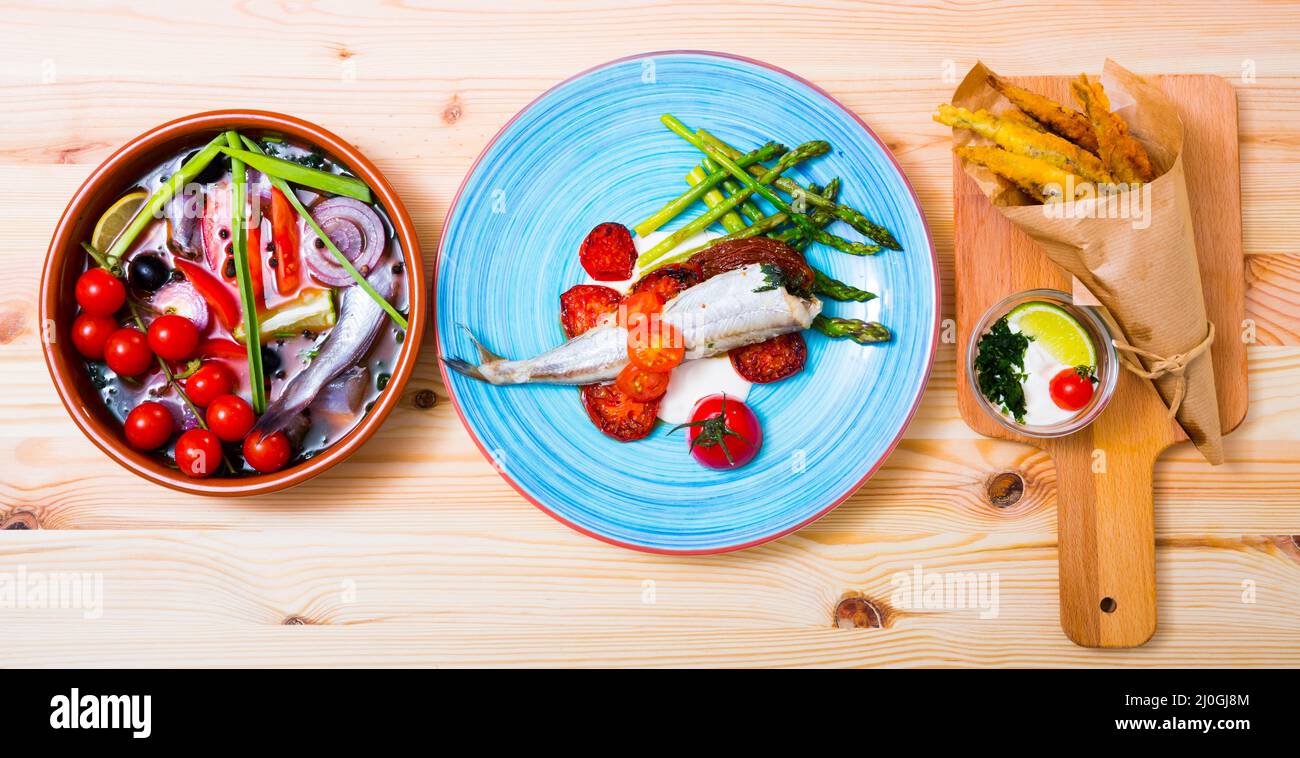 Dishes from small sea fish Stock Photo - Alamy