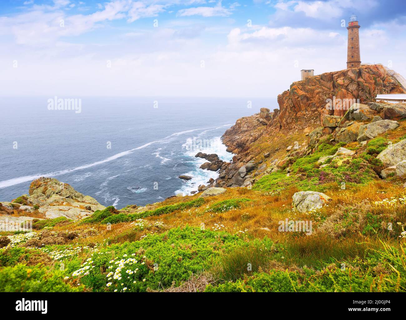 Ocean coast with lighthouse Stock Photo - Alamy