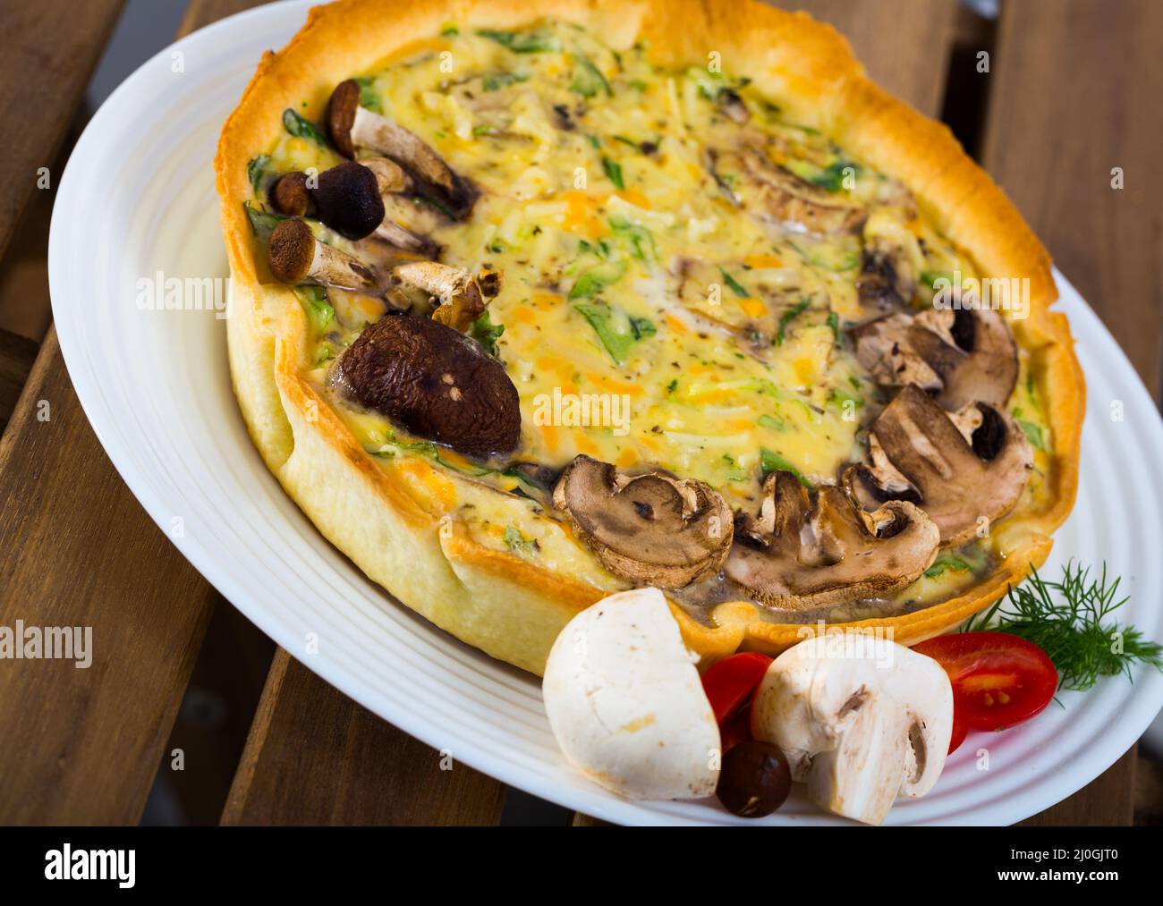 Delicious french open pie with cheese and mushrooms Stock Photo - Alamy