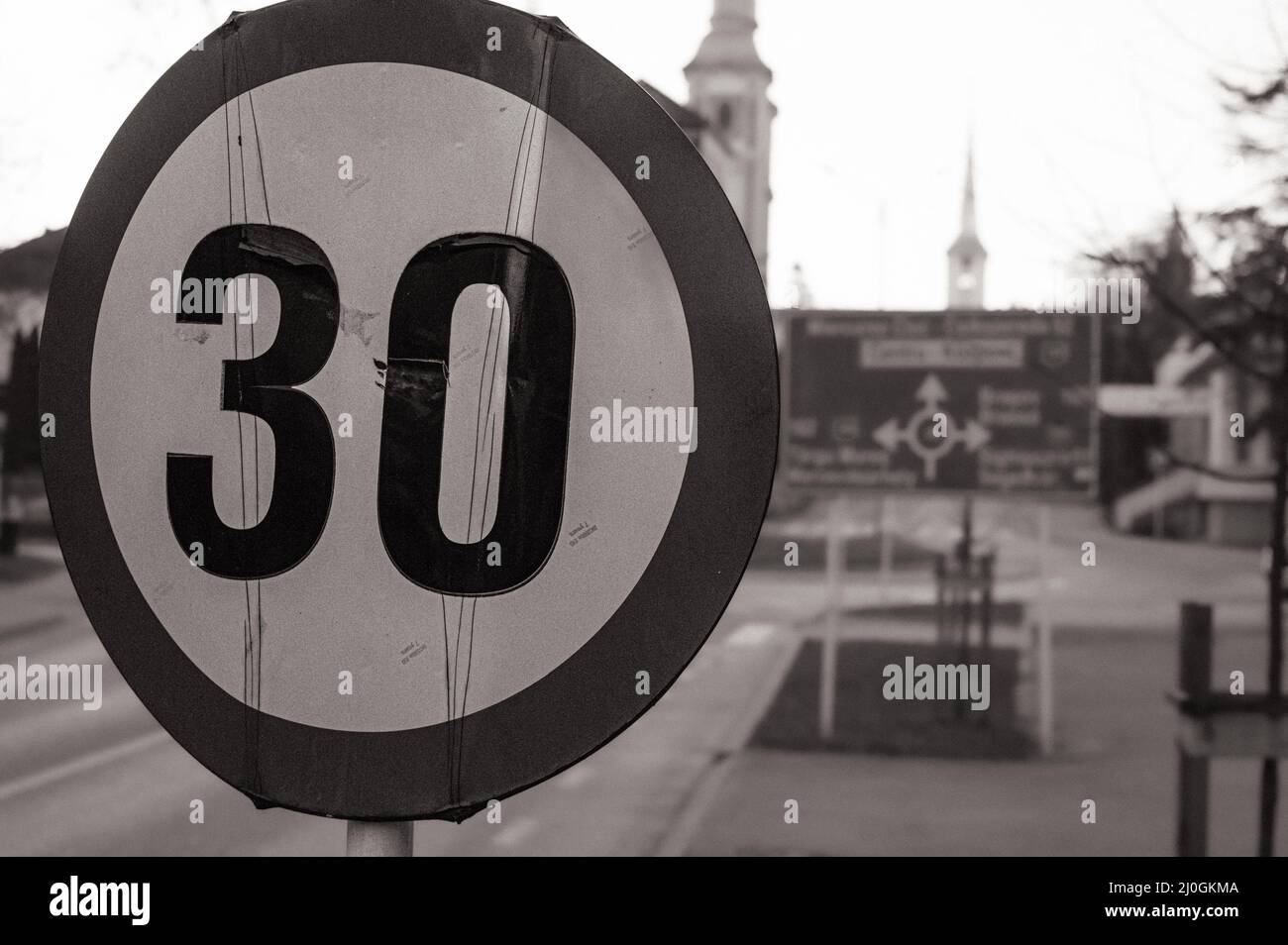 Close-up shot of a road sign "30" - in grayscale Stock Photo - Alamy
