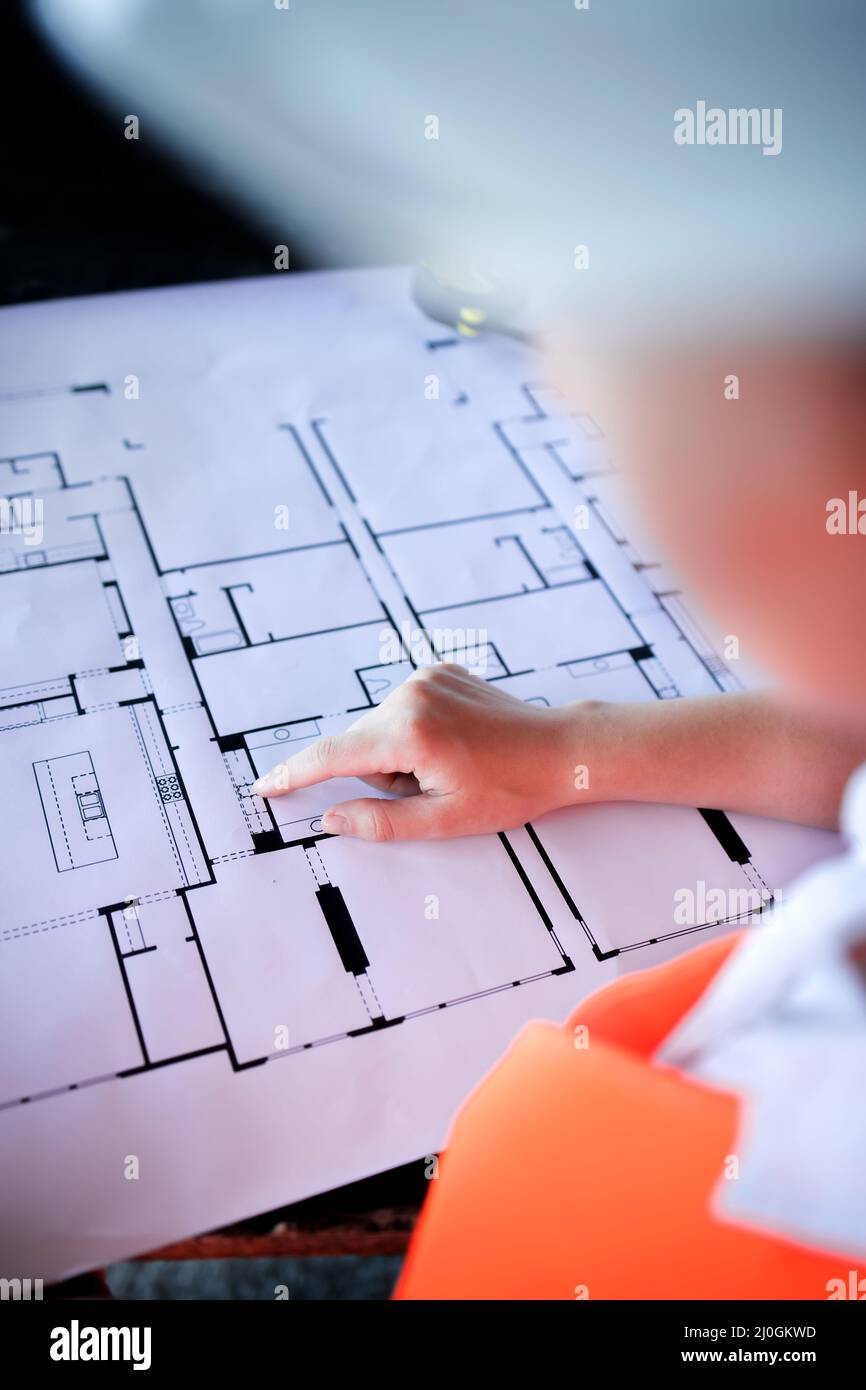 Architect working over plan. Closeup Desk With blueprints drawing Stock ...