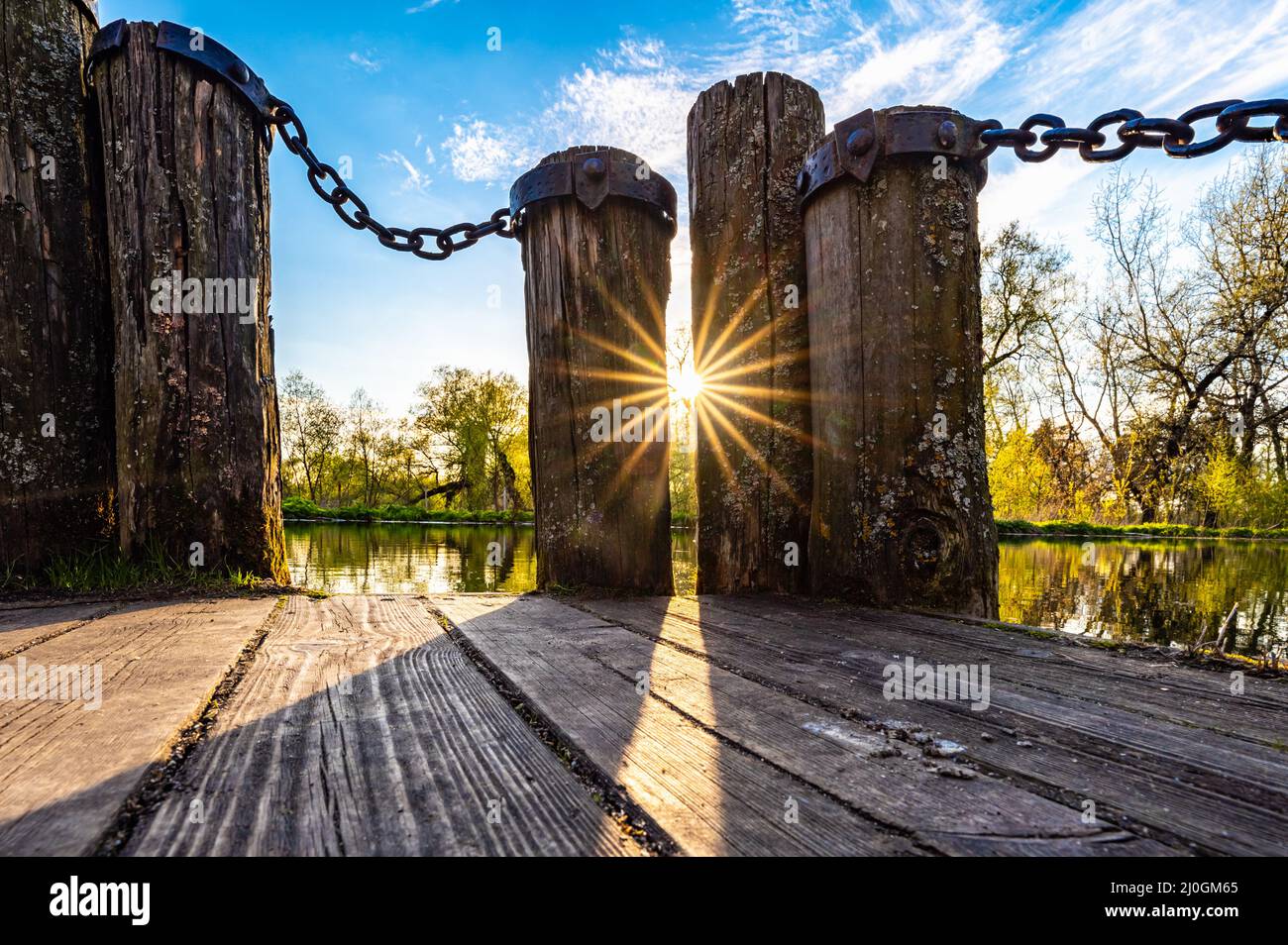 Old wooden pier with chain Stock Photo - Alamy