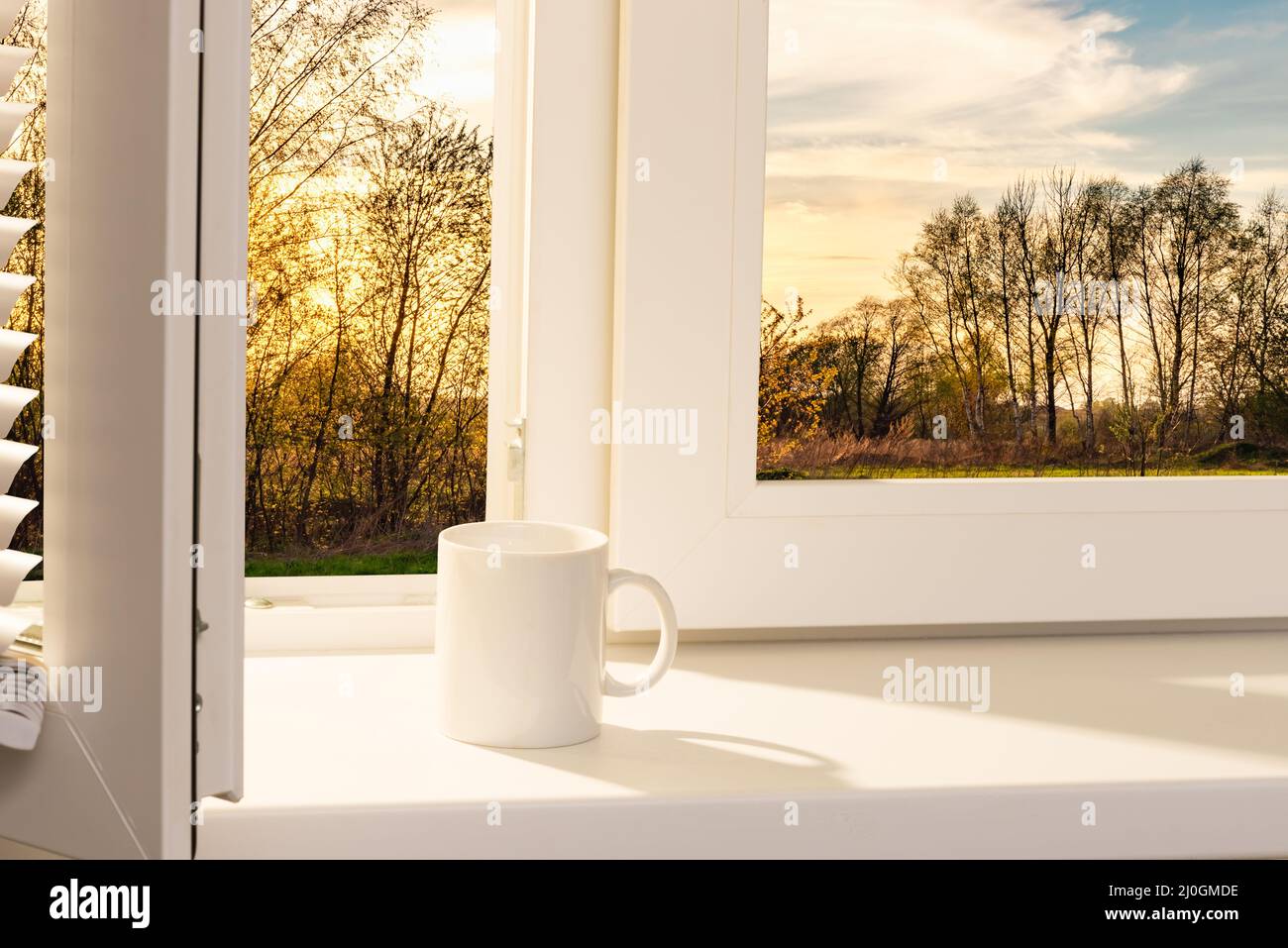 Open window with a cup of coffee on the windowsill Stock Photo - Alamy