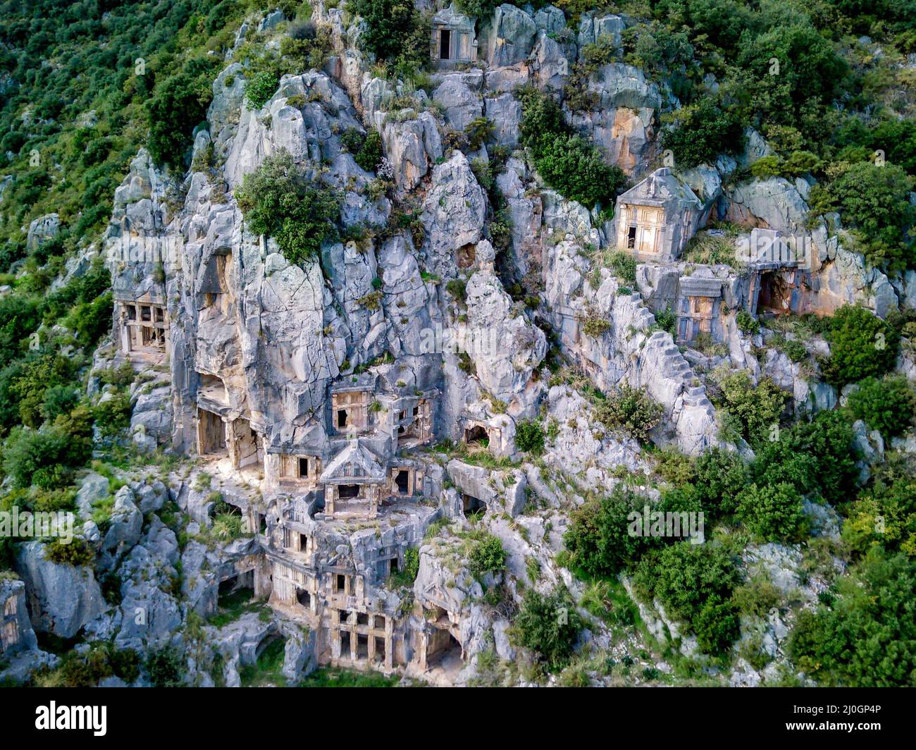High angle drone aerial view of ancient greek rock cut tombs carved ...