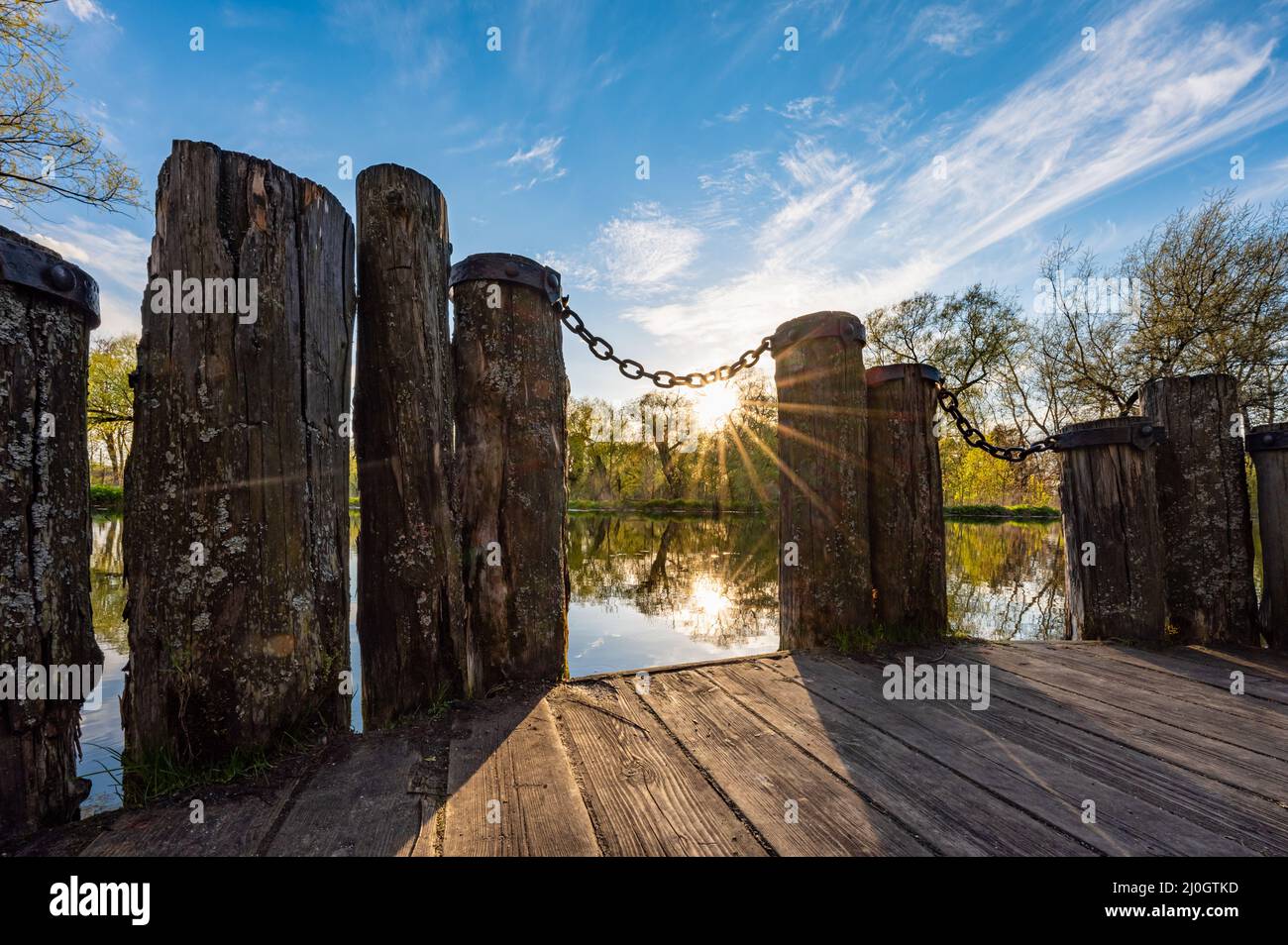 Old wooden pier with chain Stock Photo - Alamy