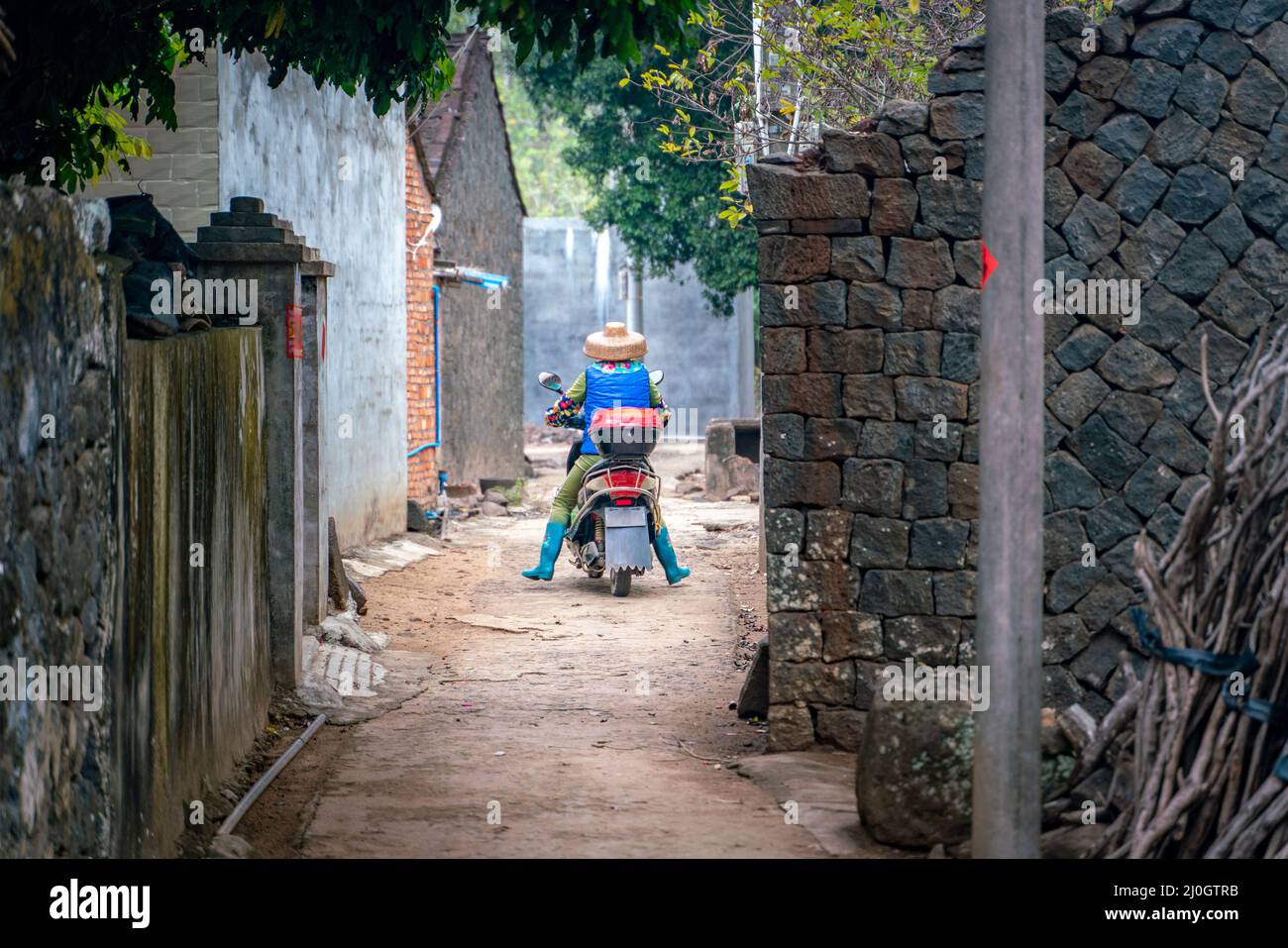 The rural street view of old traditional fisherman village on Hainan in ...