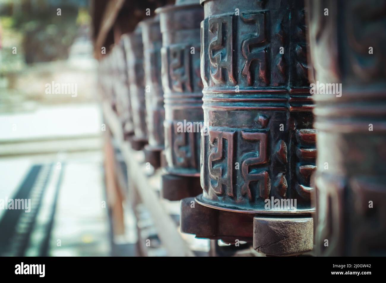 Prayer wheel in Nepal at the monkey tempole Stock Photo - Alamy