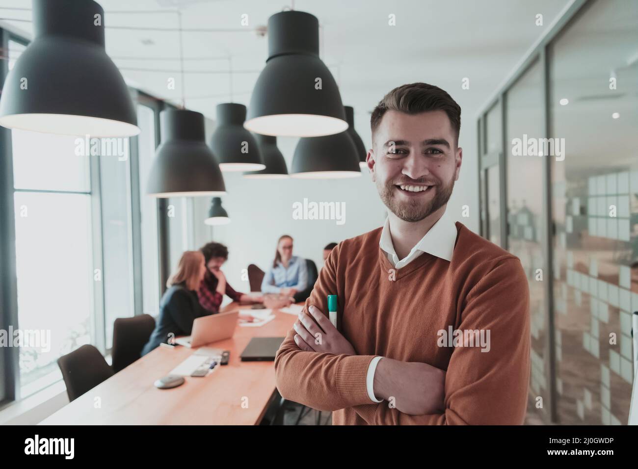 Portrait of happy millennial male business owner in modern office ...