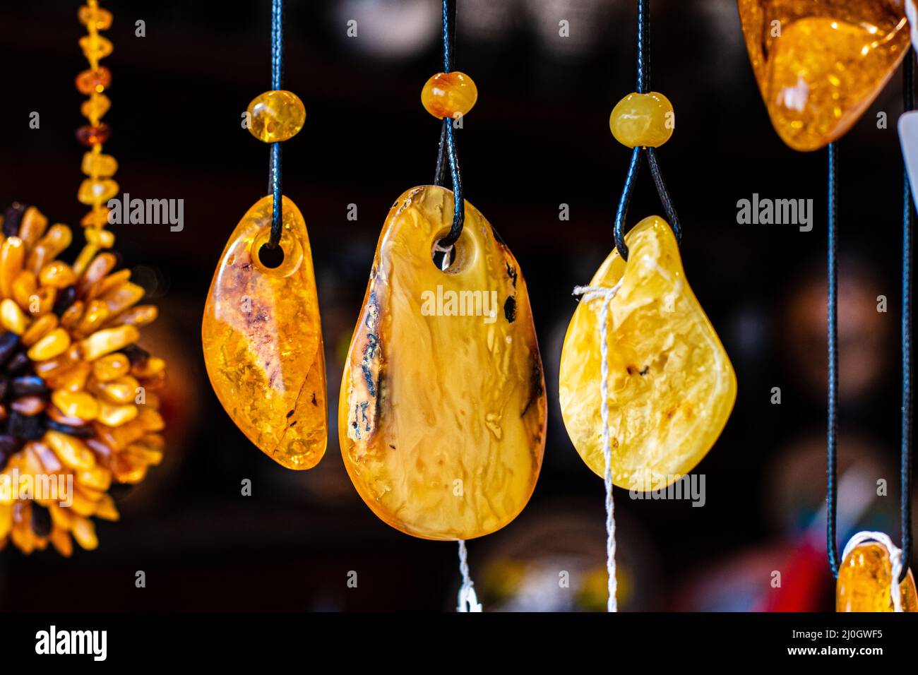 Necklaces and other amber souvenirs. Amber of different colors and ...