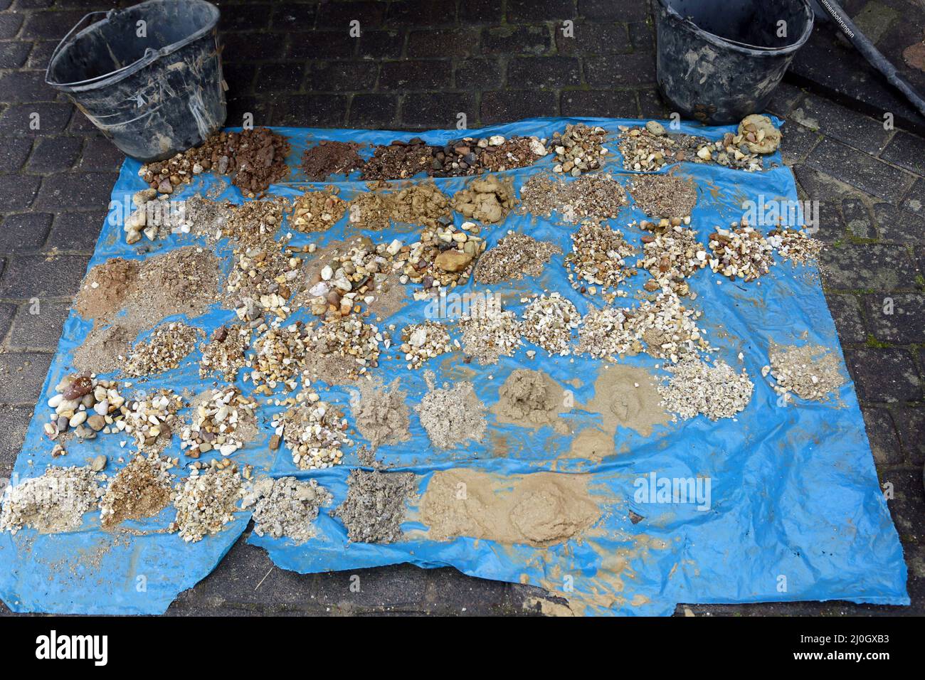 Drilling samples during the drilling of a deep well in the garden of a ...