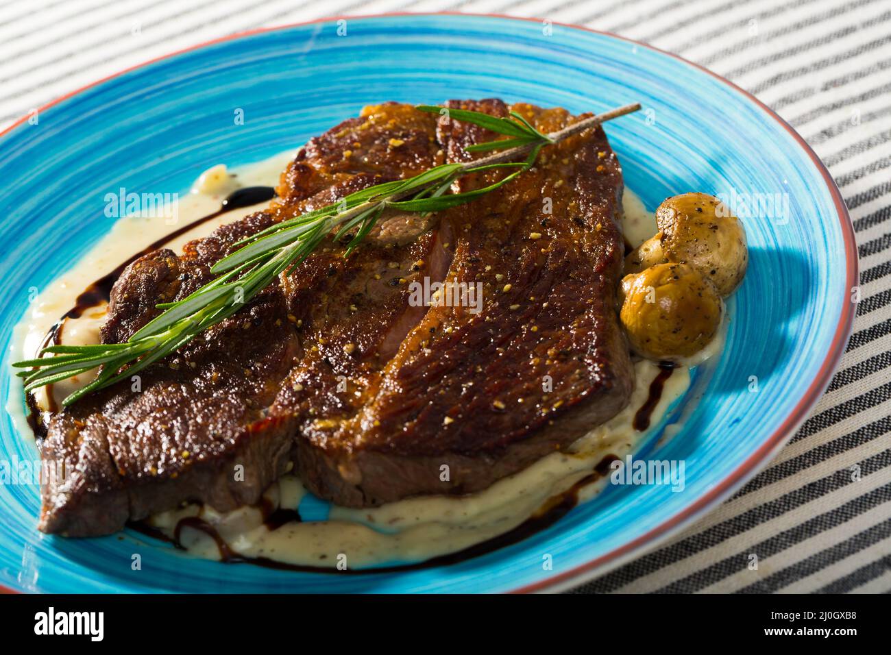 Image of beef entrecote with mushroom sauce Stock Photo - Alamy