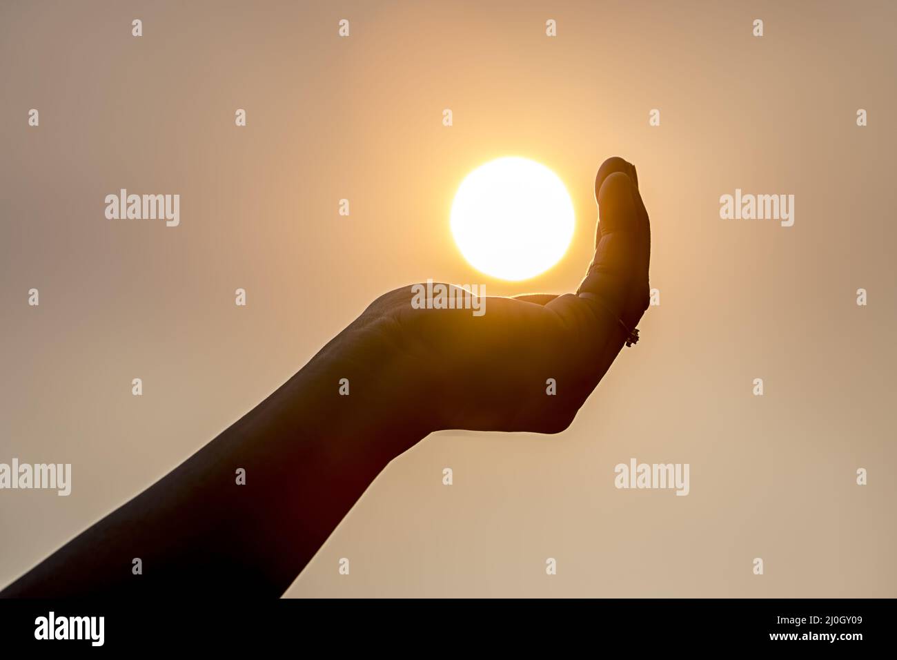 Holding sun hi-res stock photography and images - Alamy