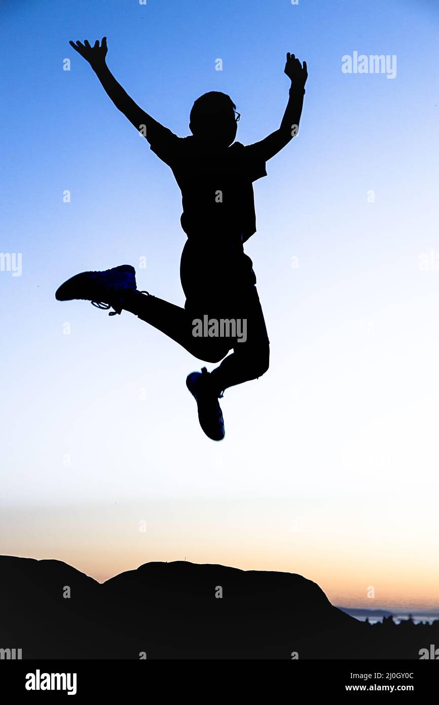 Child jumping with joy hi-res stock photography and images - Alamy