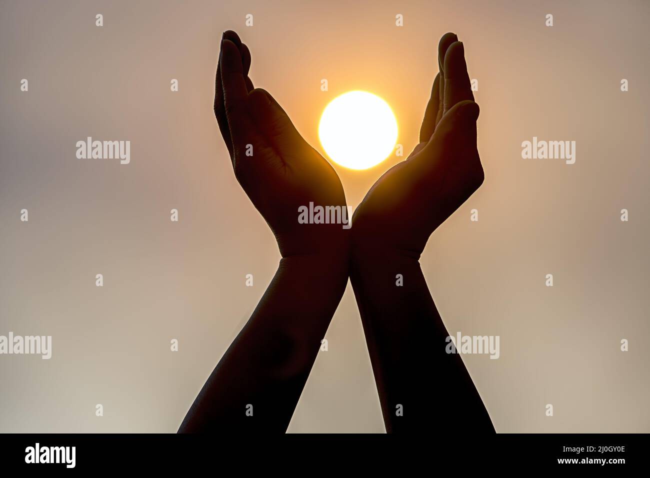 Holding sun in hands hi-res stock photography and images - Alamy