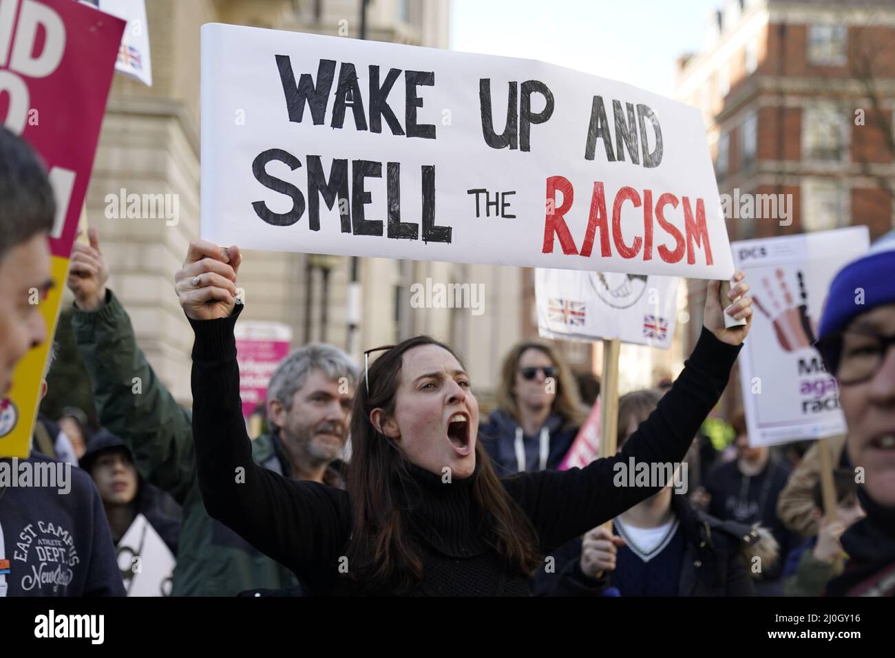 People take part in the Stand up to Racism march in central London to ...