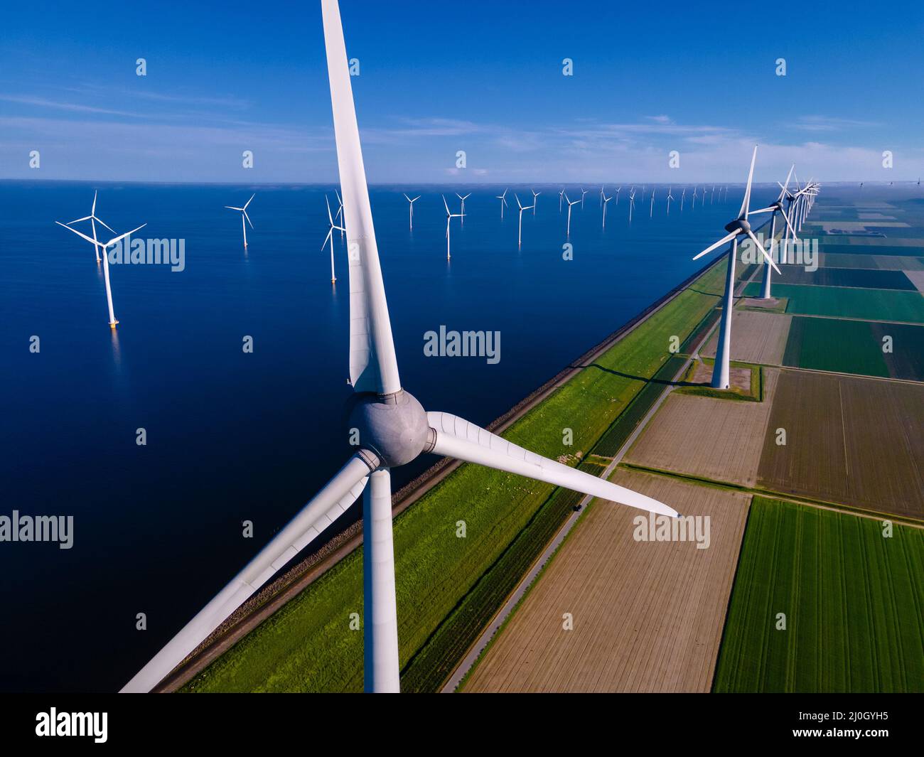 Offshore windmill park with clouds and a blue sky, windmill park in the ...