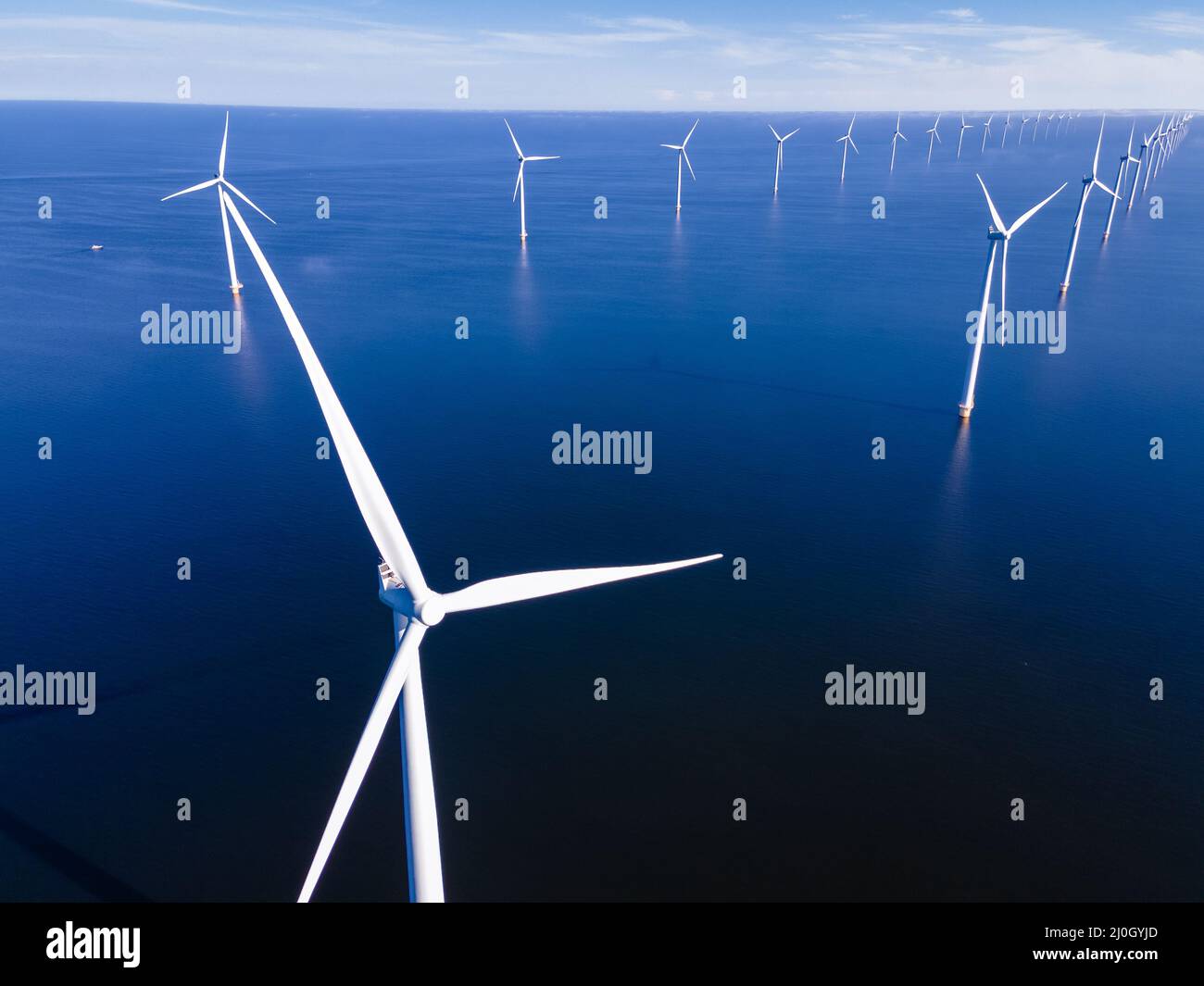 Offshore windmill park with clouds and a blue sky, windmill park in the ...