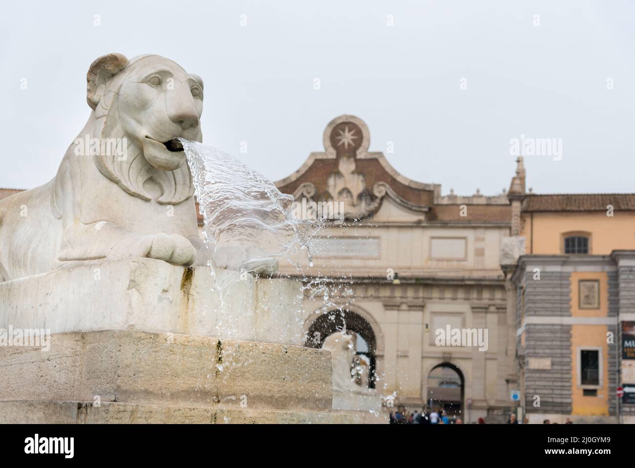 Water through the lion statue head at the Piazza del Popolo , Rome ...