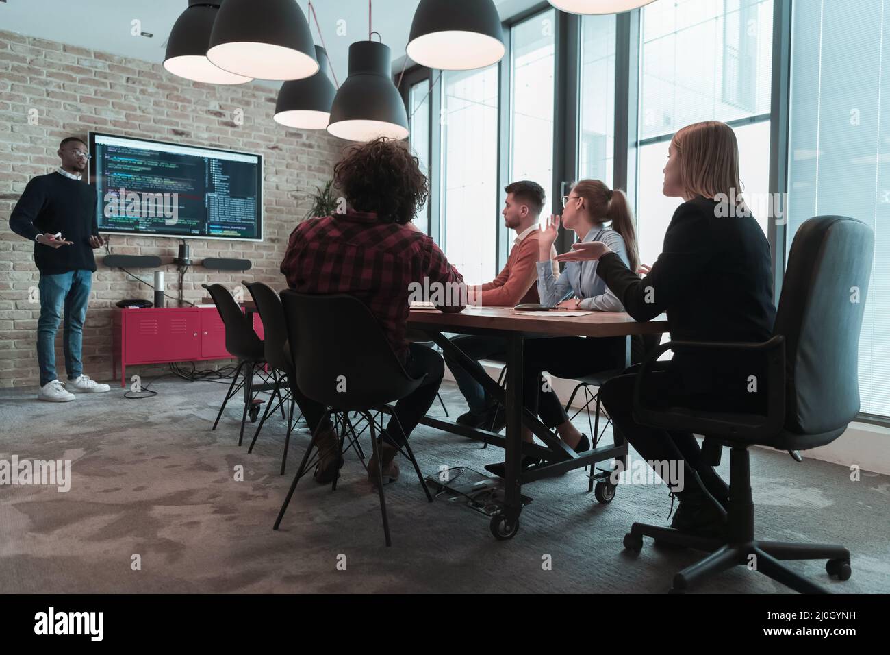 Leader give a business presentation at an office conference meeting ...