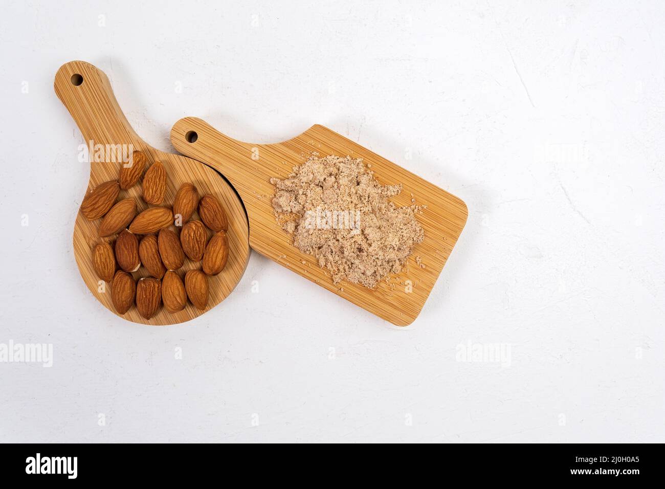 Alternative nut flour made of almond nuts, light background. Copy space ...