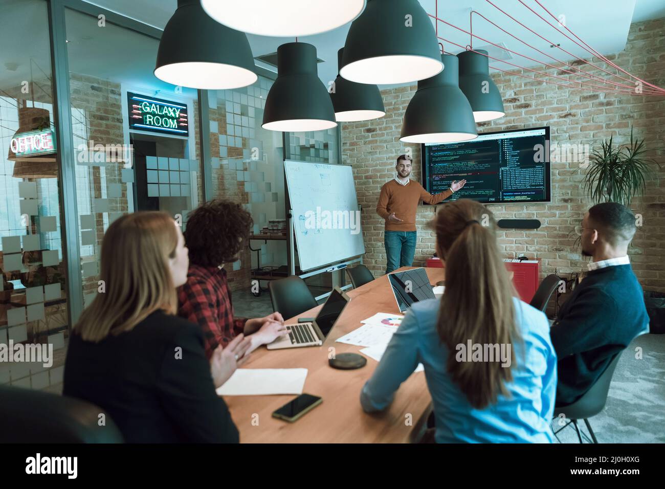 Leader give a business presentation at an office conference meeting ...