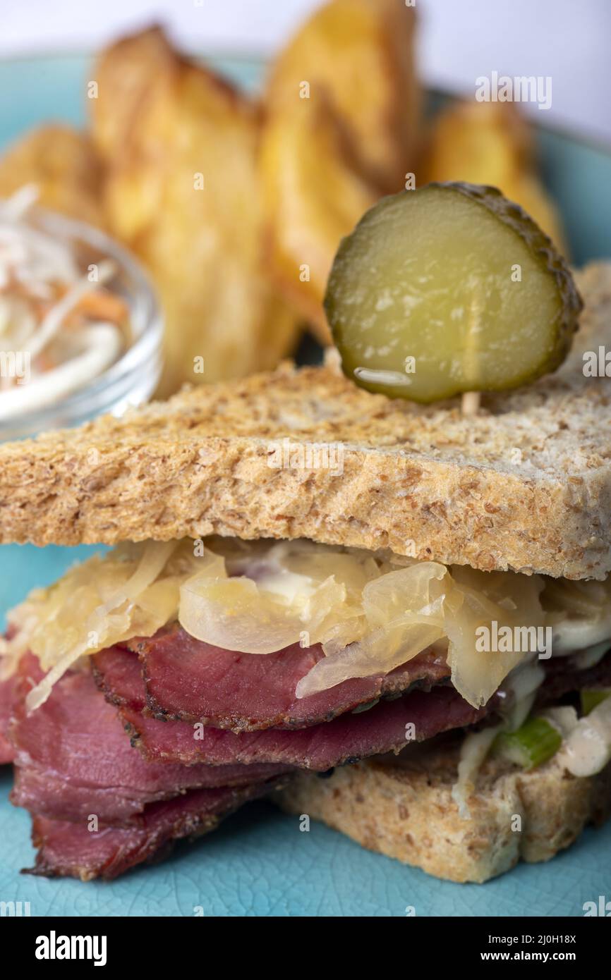Reuben Sandwich on rustic wood Stock Photo - Alamy