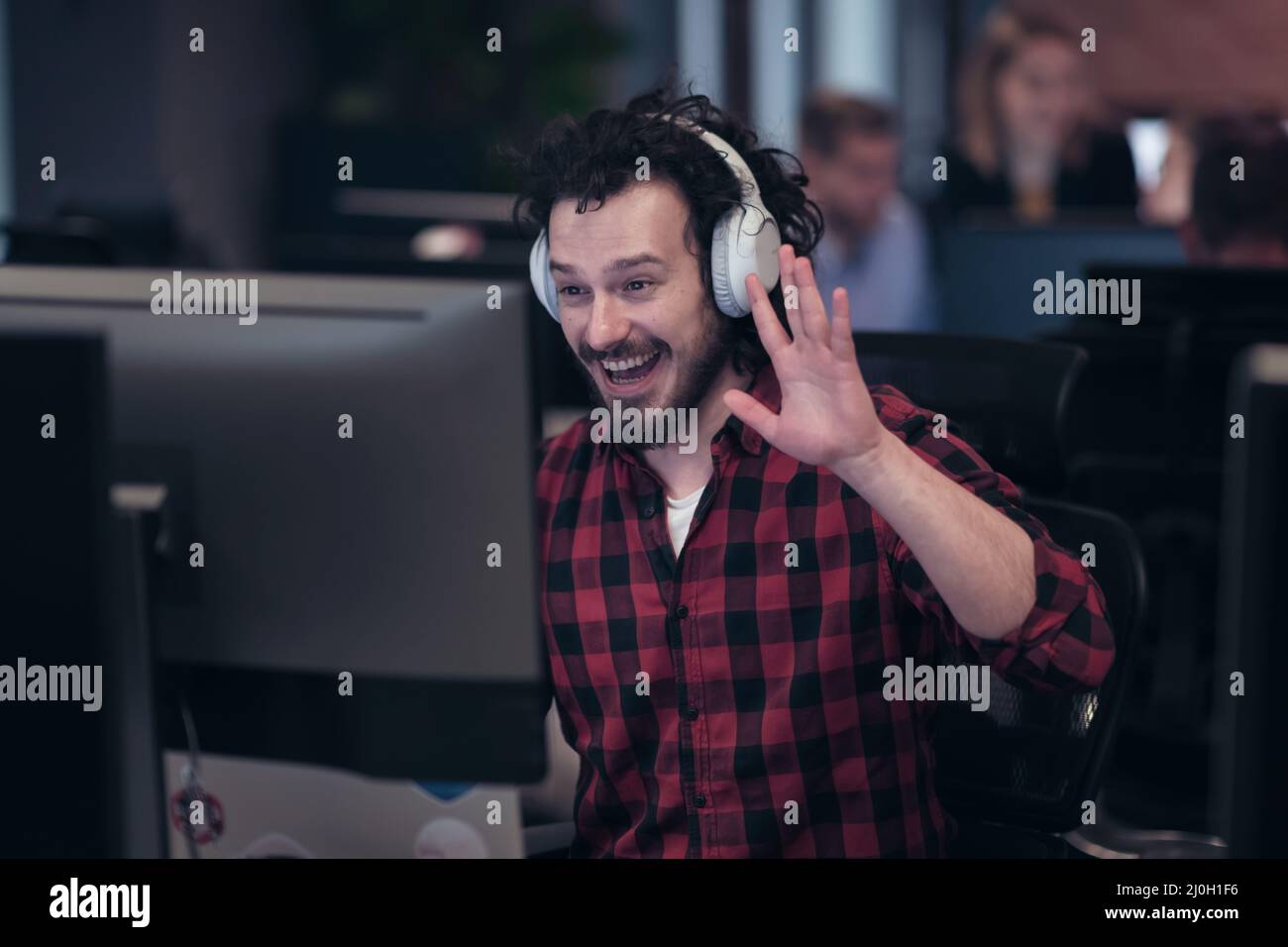 Funny businessman wearing headset having virtual team meeting group ...