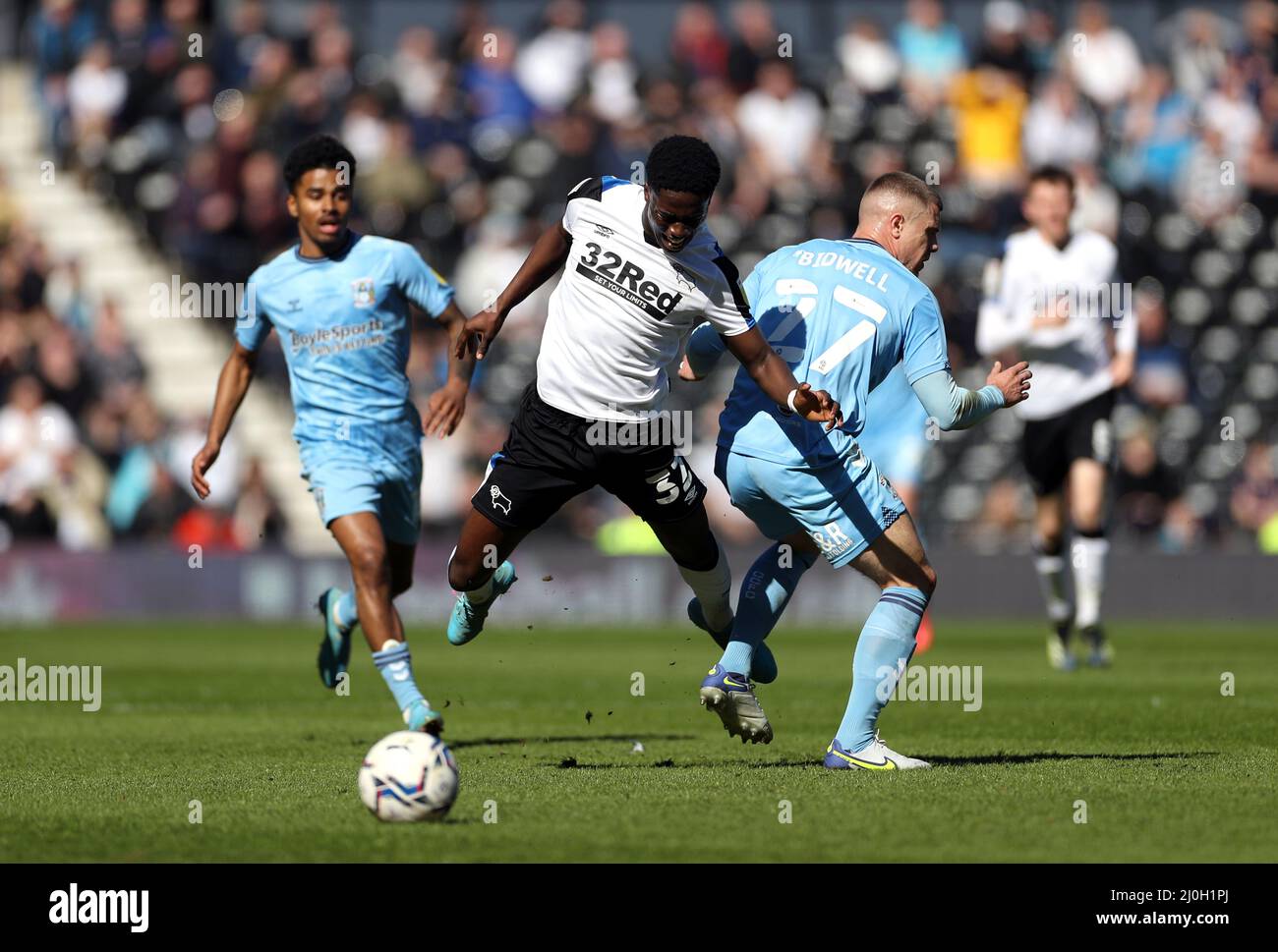 Coventry City's Jake Bidwell (left) and Derby County's Malcolm Ebiowei ...