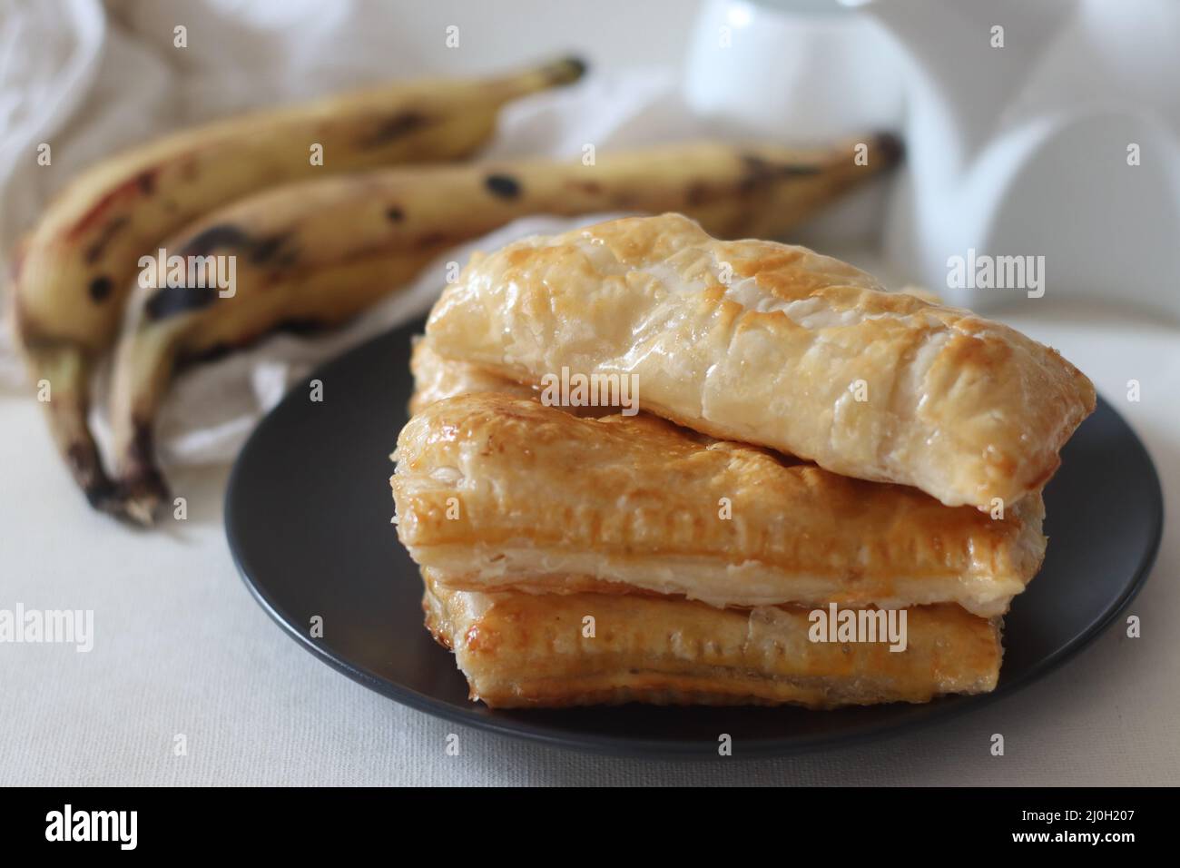 Plantain puff. Ripe plantain slices wrapped in a puff pastry sheets and ...