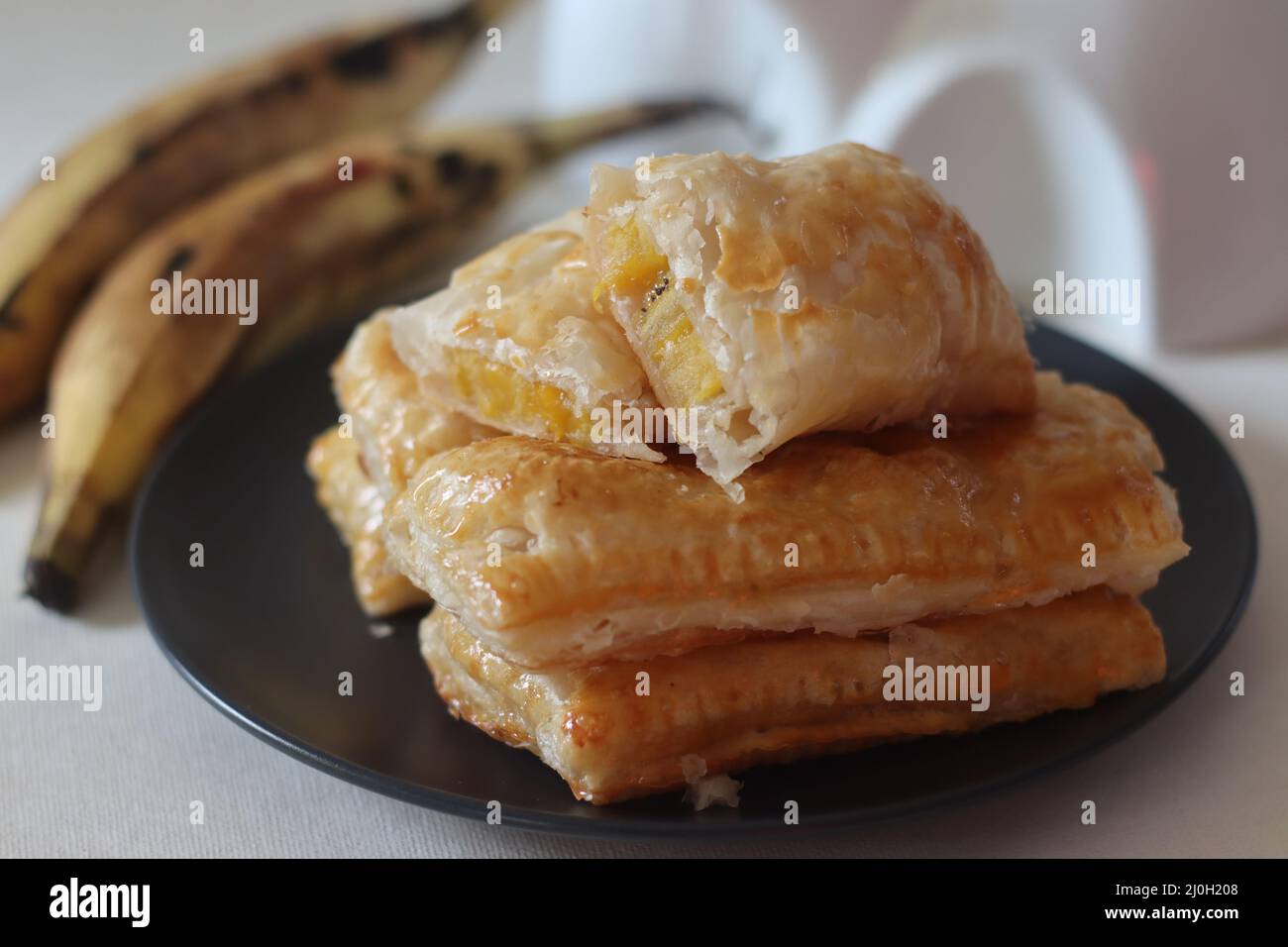Plantain puff. Ripe plantain slices wrapped in a puff pastry sheets and ...