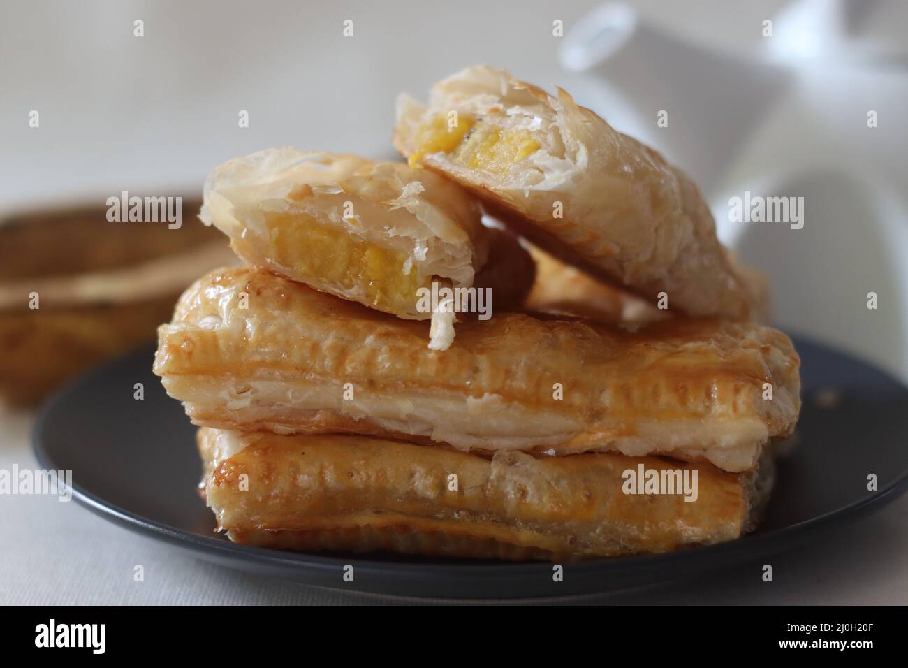 Plantain puff. Ripe plantain slices wrapped in a puff pastry sheets and ...