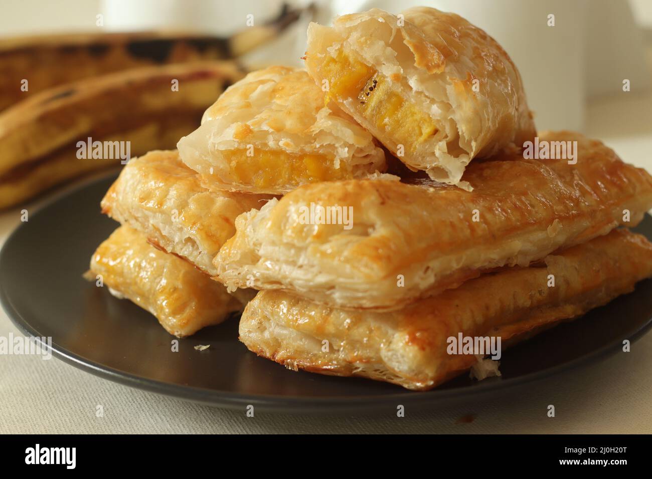 Plantain puff. Ripe plantain slices wrapped in a puff pastry sheets and ...