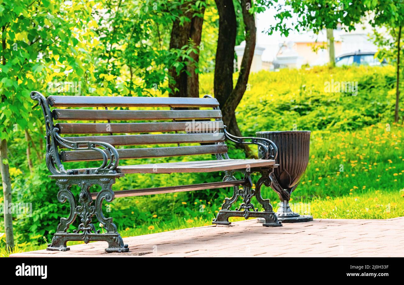 For rest in the park a bench Stock Photo - Alamy