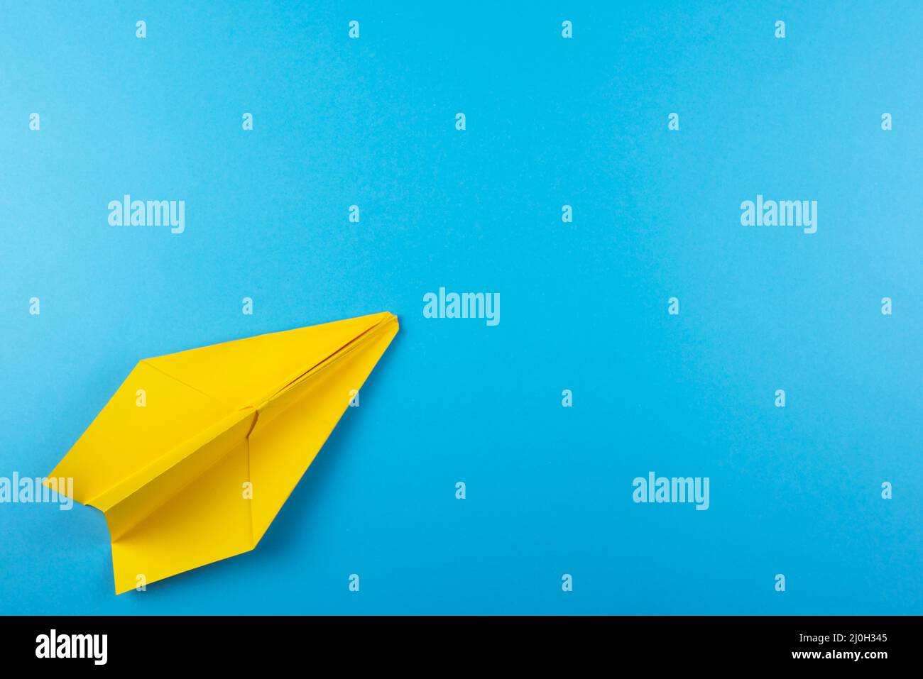 Flat lay of color paper plane Stock Photo - Alamy