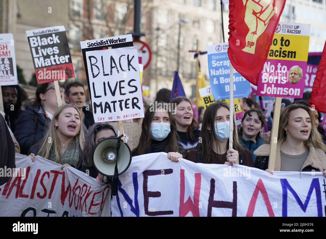 People take part in the Stand up to Racism march in central London to ...