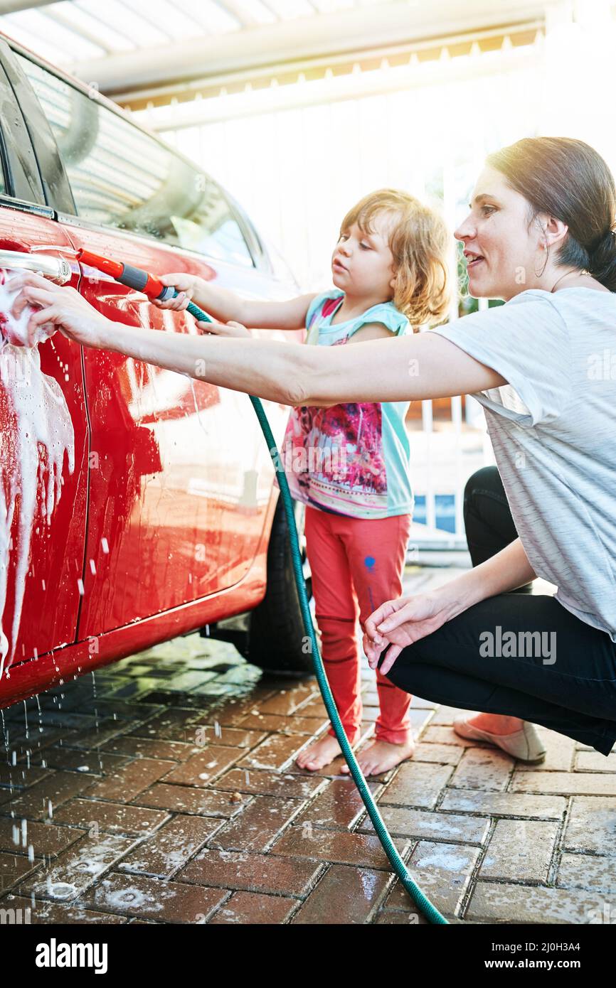 Child and women washing car together hi-res stock photography and ...