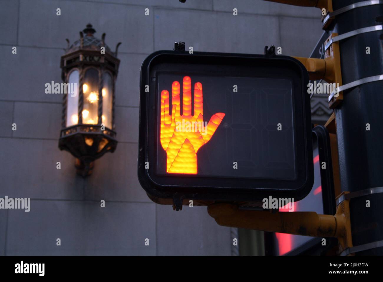 Hand warning sign on a screen Stock Photo - Alamy
