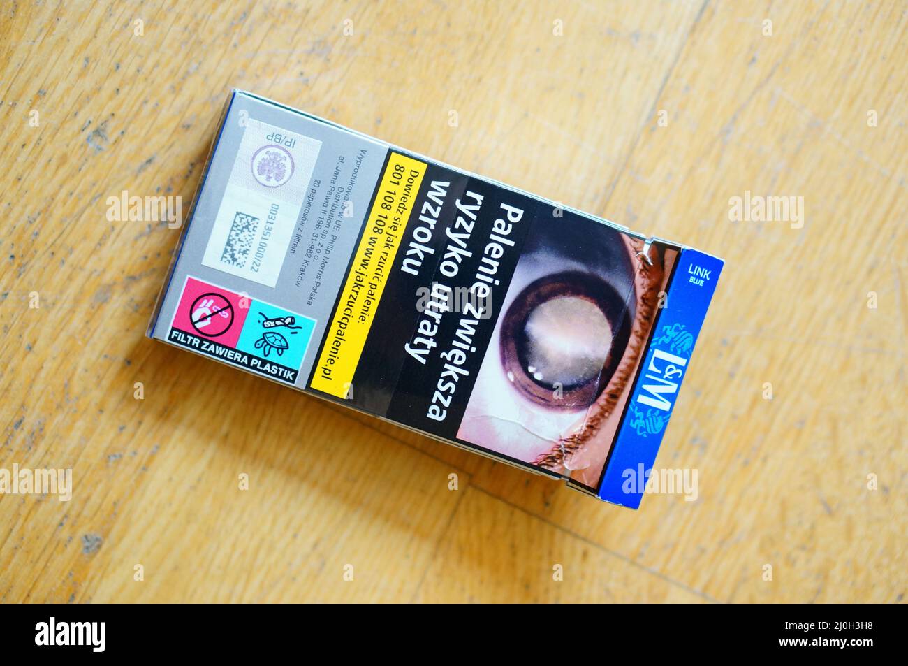 Close-up vertical shot of an L&M Link brand pack of cigarettes laying ...