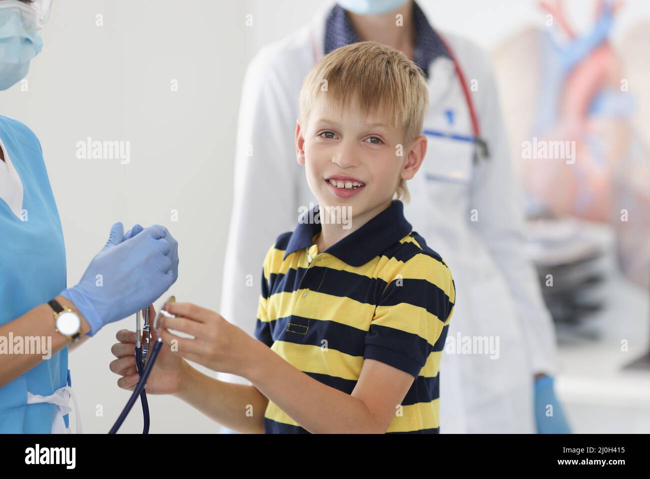 Boy kid on appointment in clinic, pediatrician going to examine health ...