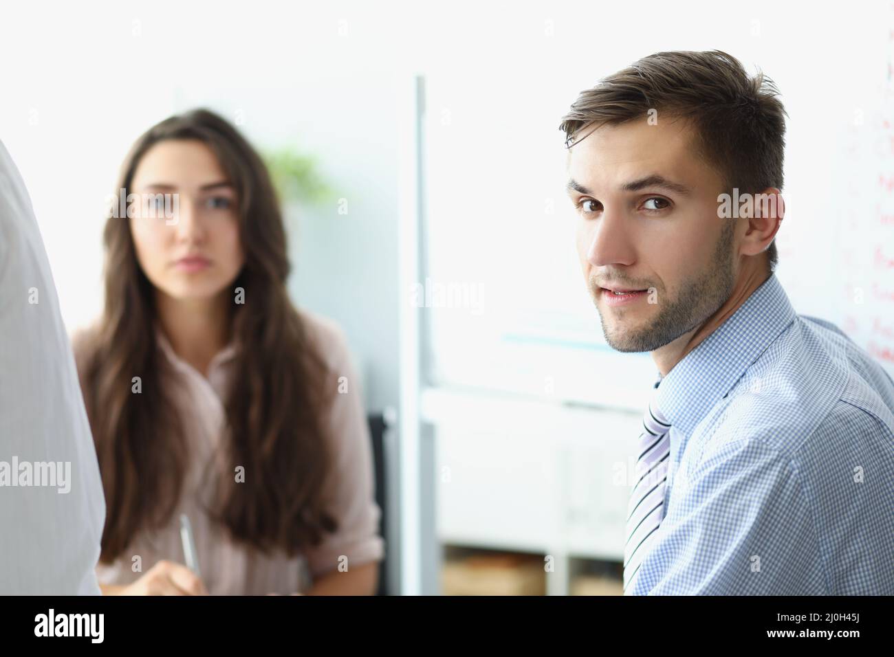 Man business employee on workplace, clerk look in camera on conference ...
