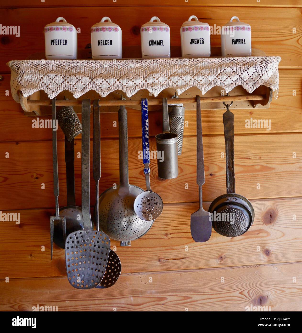 Old kitchen utensils hanging hi-res stock photography and images - Alamy
